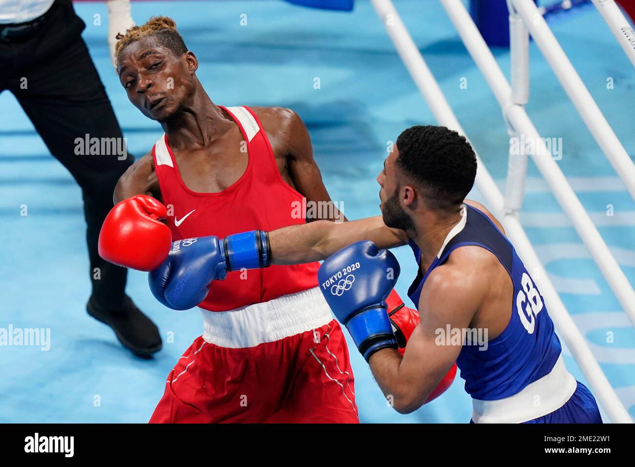 Zambia's Patrick Chinyemba, left, exchanges punches with Britain's ...