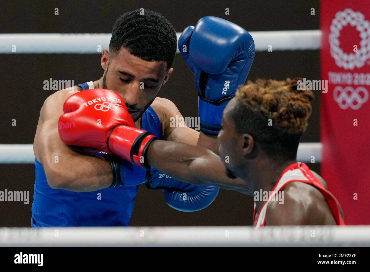 Zambia's Patrick Chinyemba, right, exchanges punches with Britain's ...