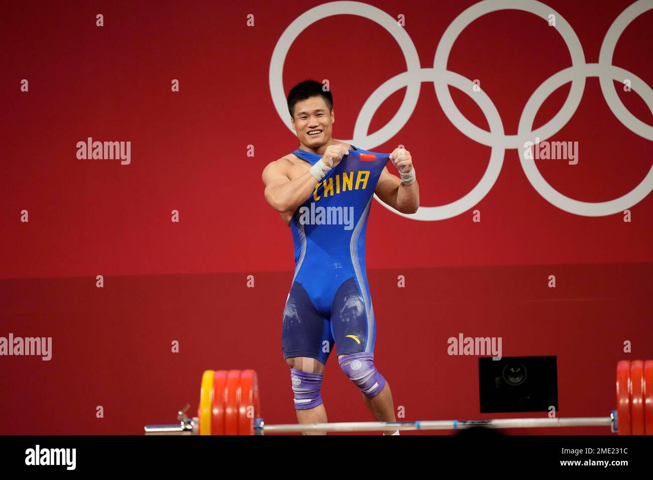 Lyu Xiaojun of China celebrates after a lift in the men's 81kg ...