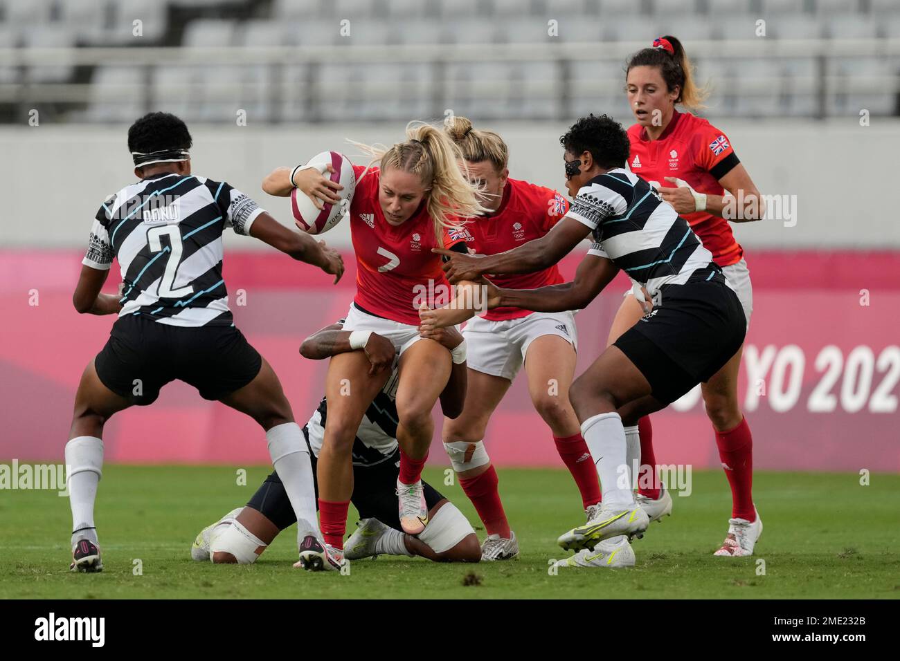 Britain's Emma Uren is surrounded by Fiji defenders in the women's ...