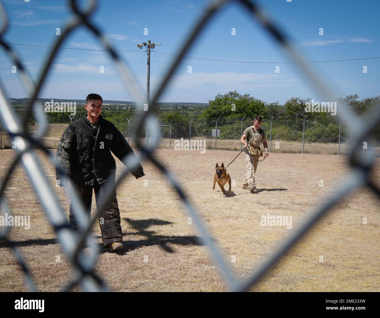 Cpl. Kody Knecht, right, a military working dog handler with the 226th ...