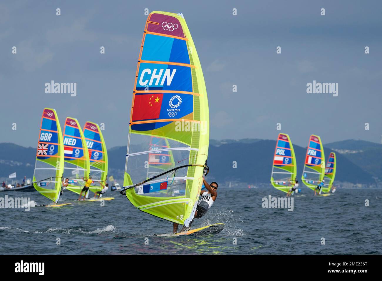China's Bi Kun competes in the men's windsurfer medal race at the 2020 ...