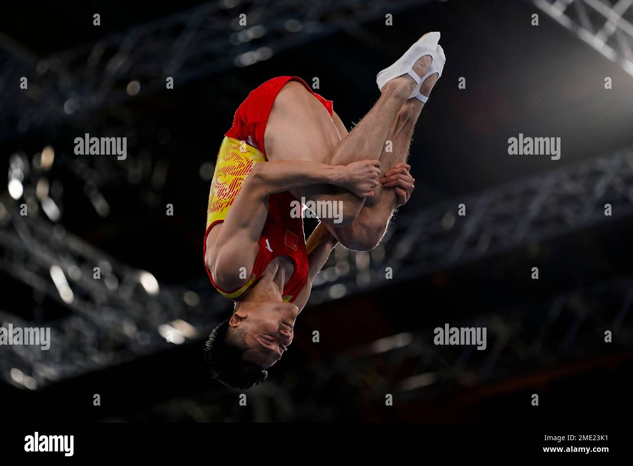 Dong Dong, of China, competes in the men's in the men's trampoline ...