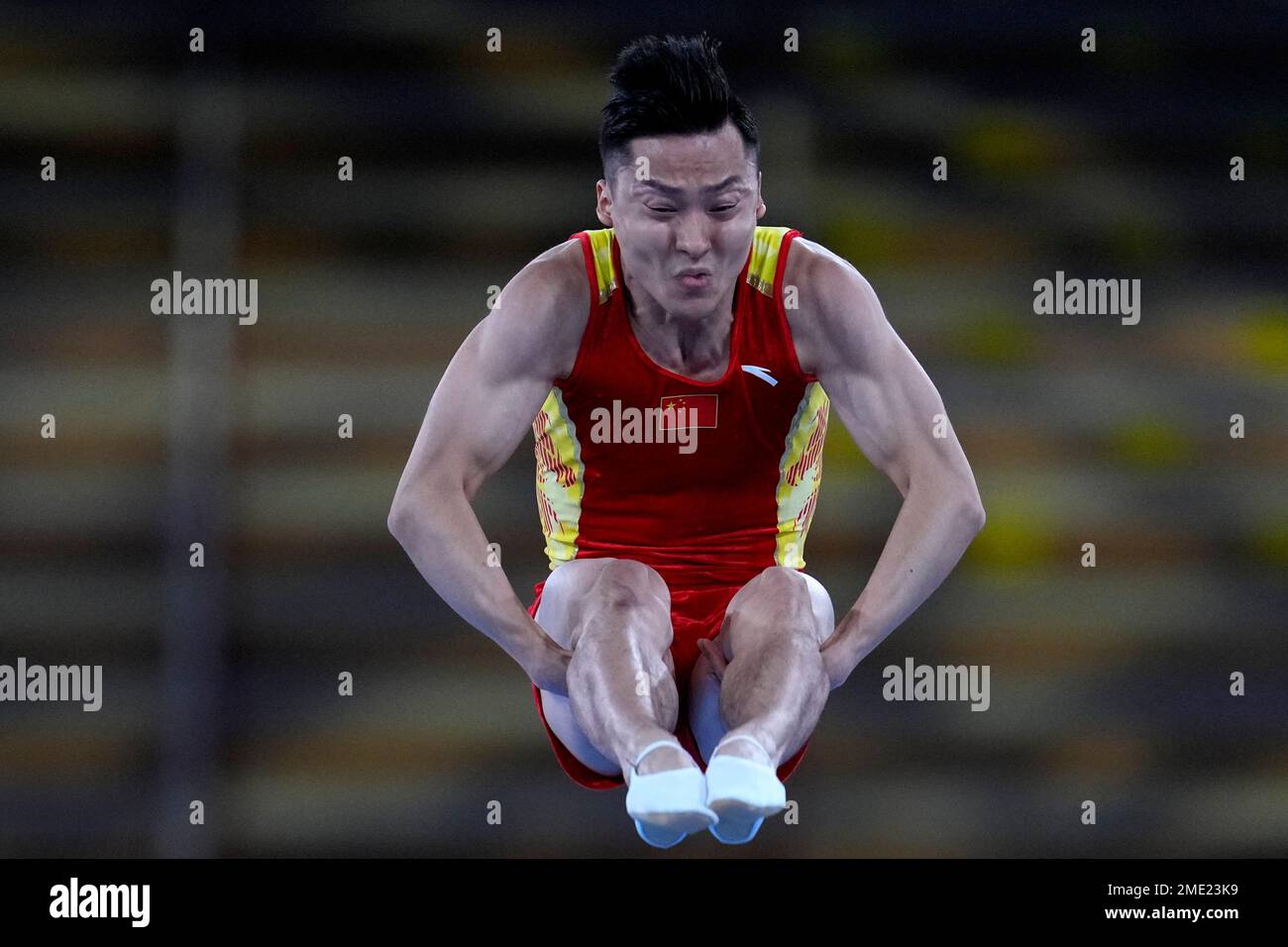 Dong Dong, of China, performs in a men's trampoline gymnastics ...