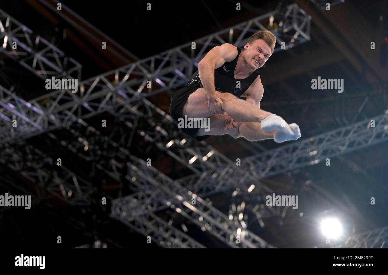 Dylan Schmidt, of New Zealand, performs in the men's trampoline ...
