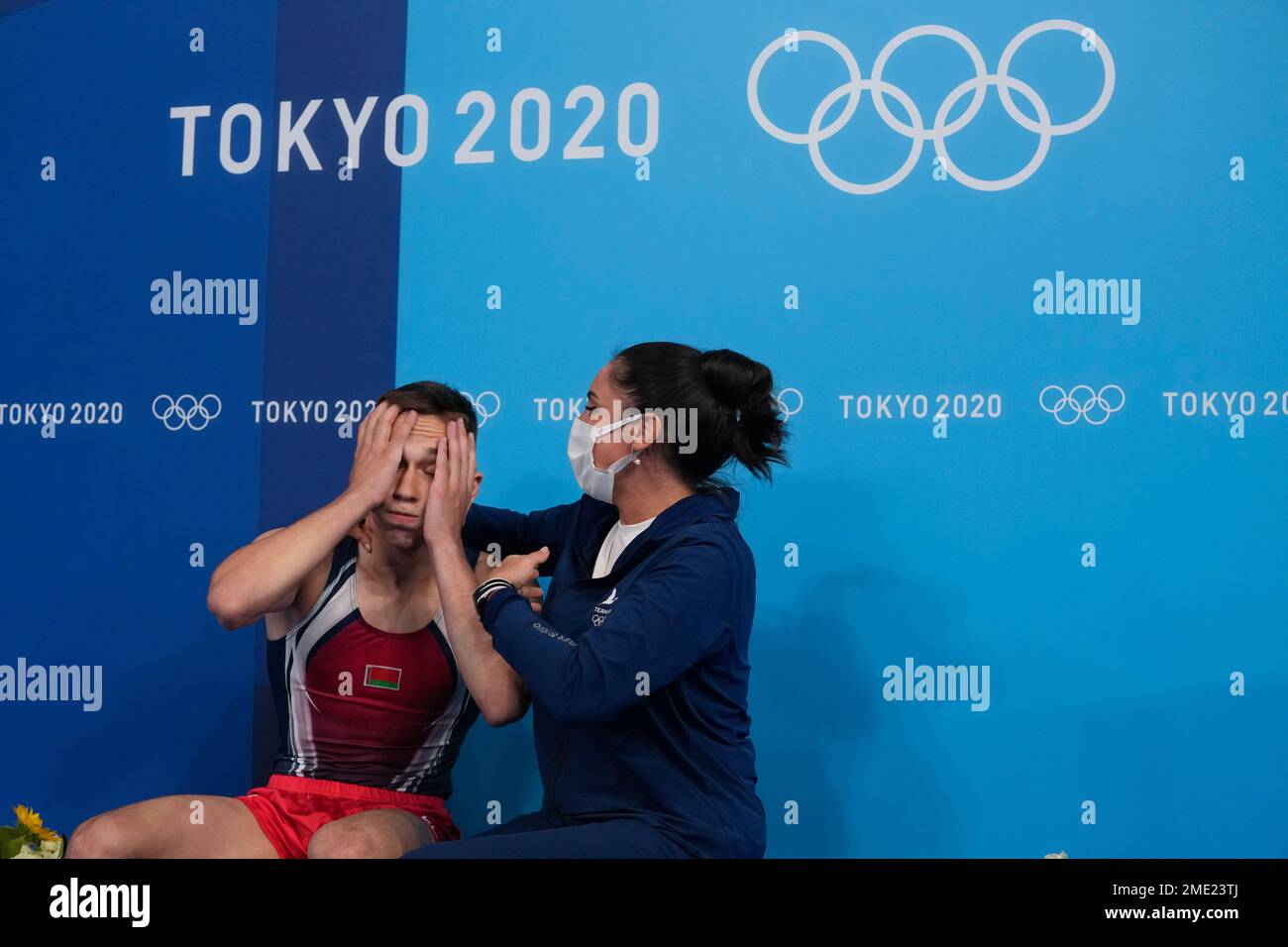 Ivan Litvinovich, left, of Belarus, reacts after winning the men's ...