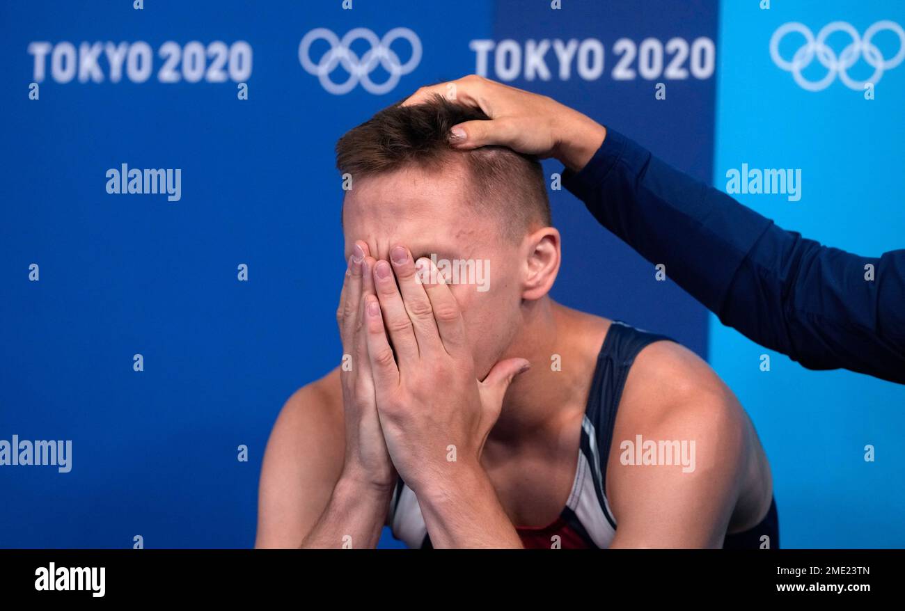 Ivan Litvinovich of Belarus, reacts after winning the men's trampoline ...