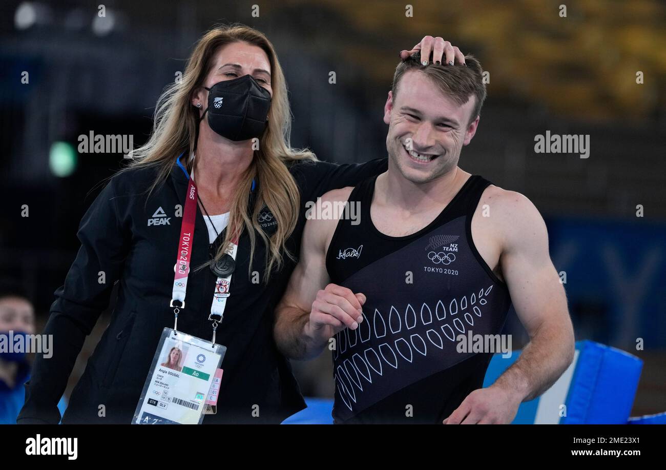 Dylan Schmidt, of New Zealand, reacts after competing at the men's ...