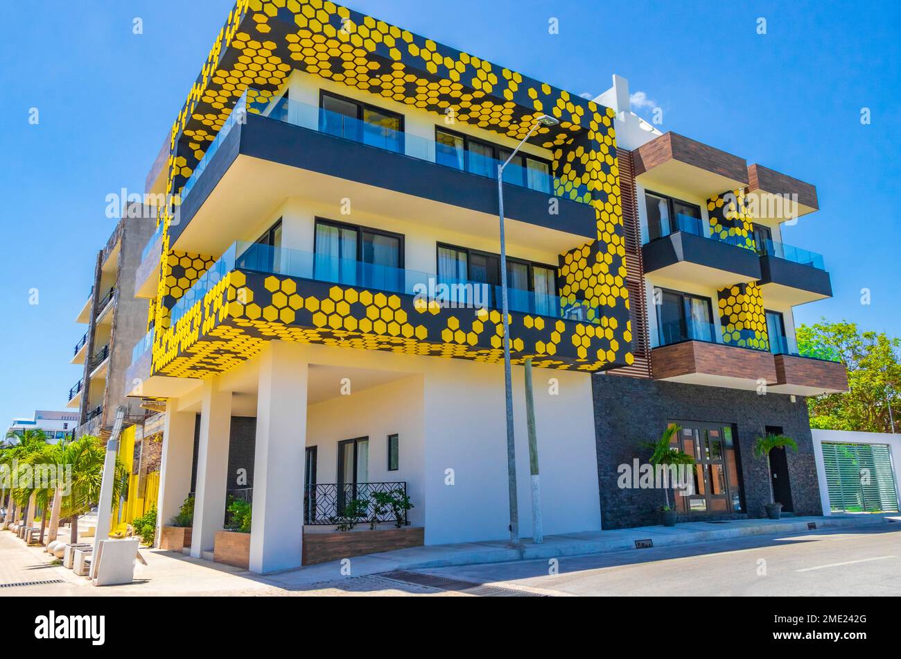 Yellow hotel building in honeycomb design in Playa del Carmen Quintana ...