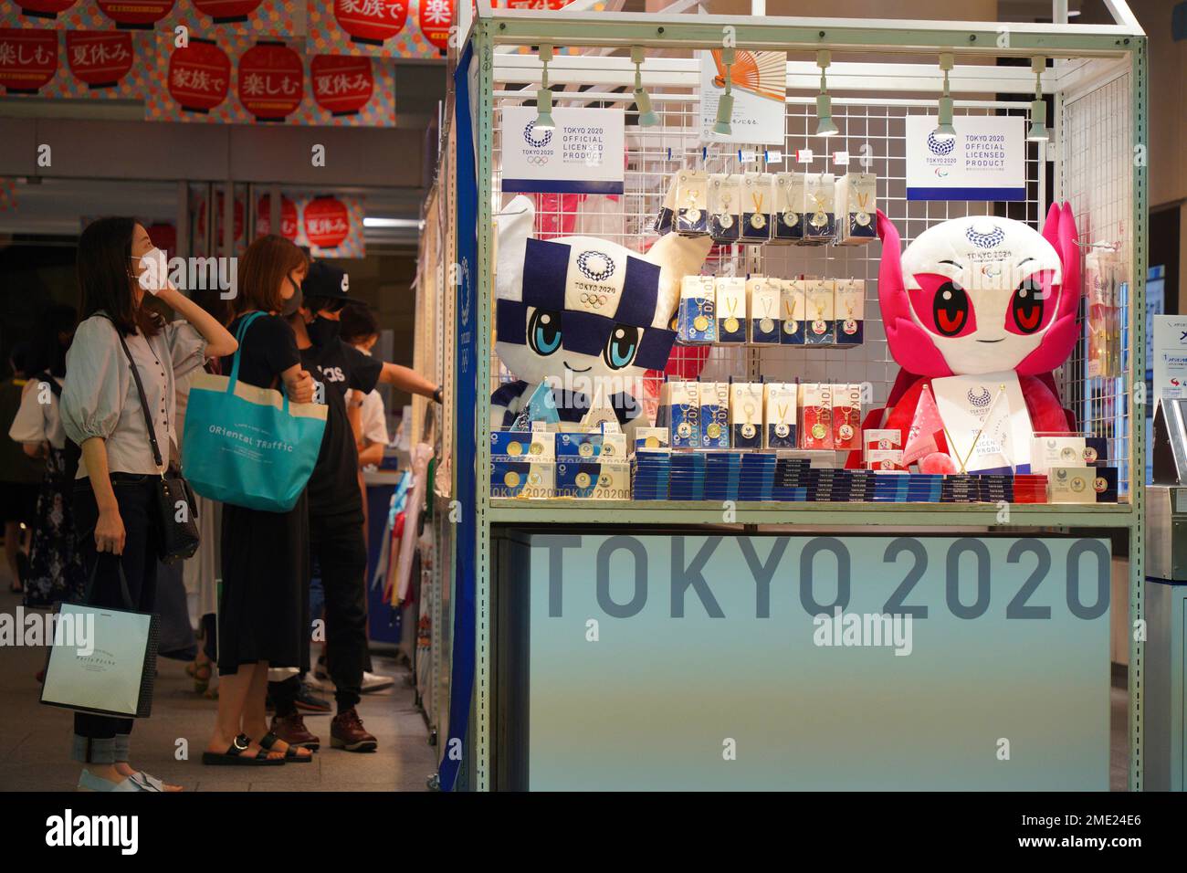 People stop by at the Tokyo 2020 Olympics official merchandise shop in ...