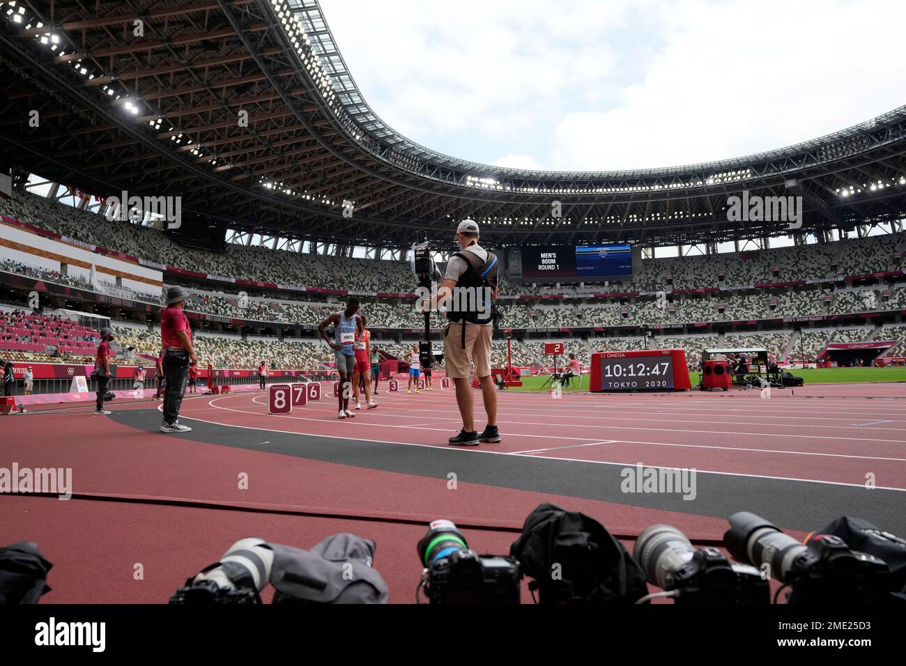 A cameraman works at an athletics competition at the 2020 Summer ...