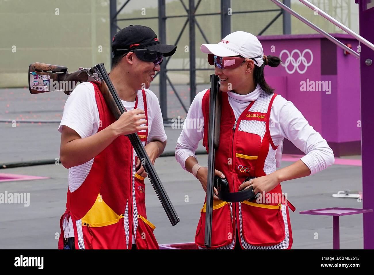 Yu Haicheng, left, and Wang Xiaojing, both of China, talk after competing in the mixed team trap ...