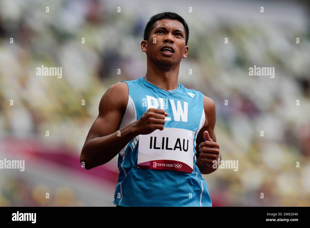 Adrian Ililau, of Palau, competes in a heat in the men's 100-meter run ...
