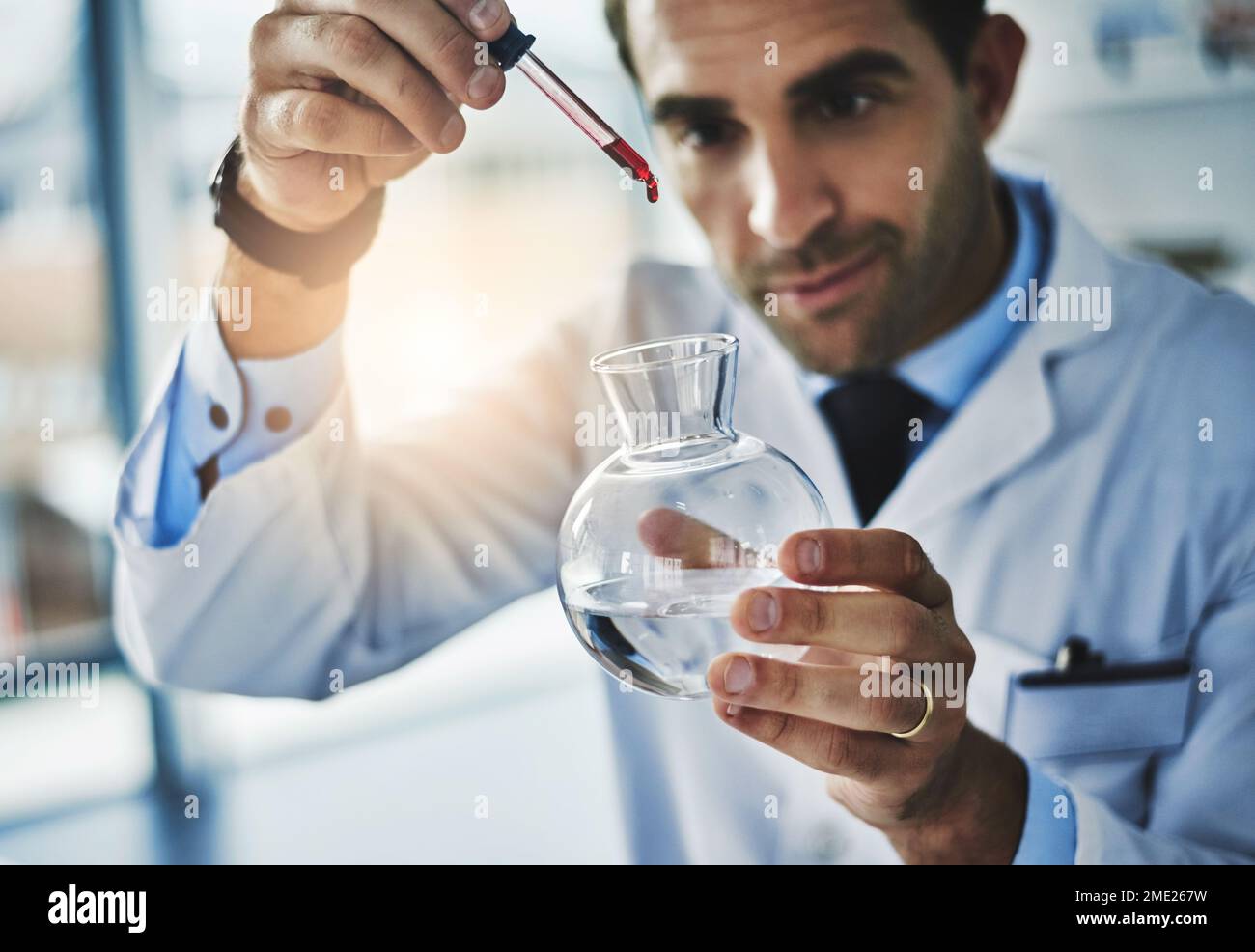 Another day, another discovery. a scientist conducting an experiment in ...