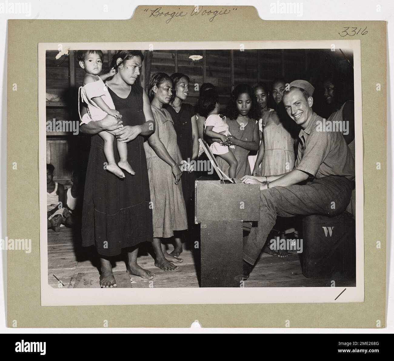 Coast Guardsman Joseph Baldwin Jr., Yeoman First Class, plays the ...