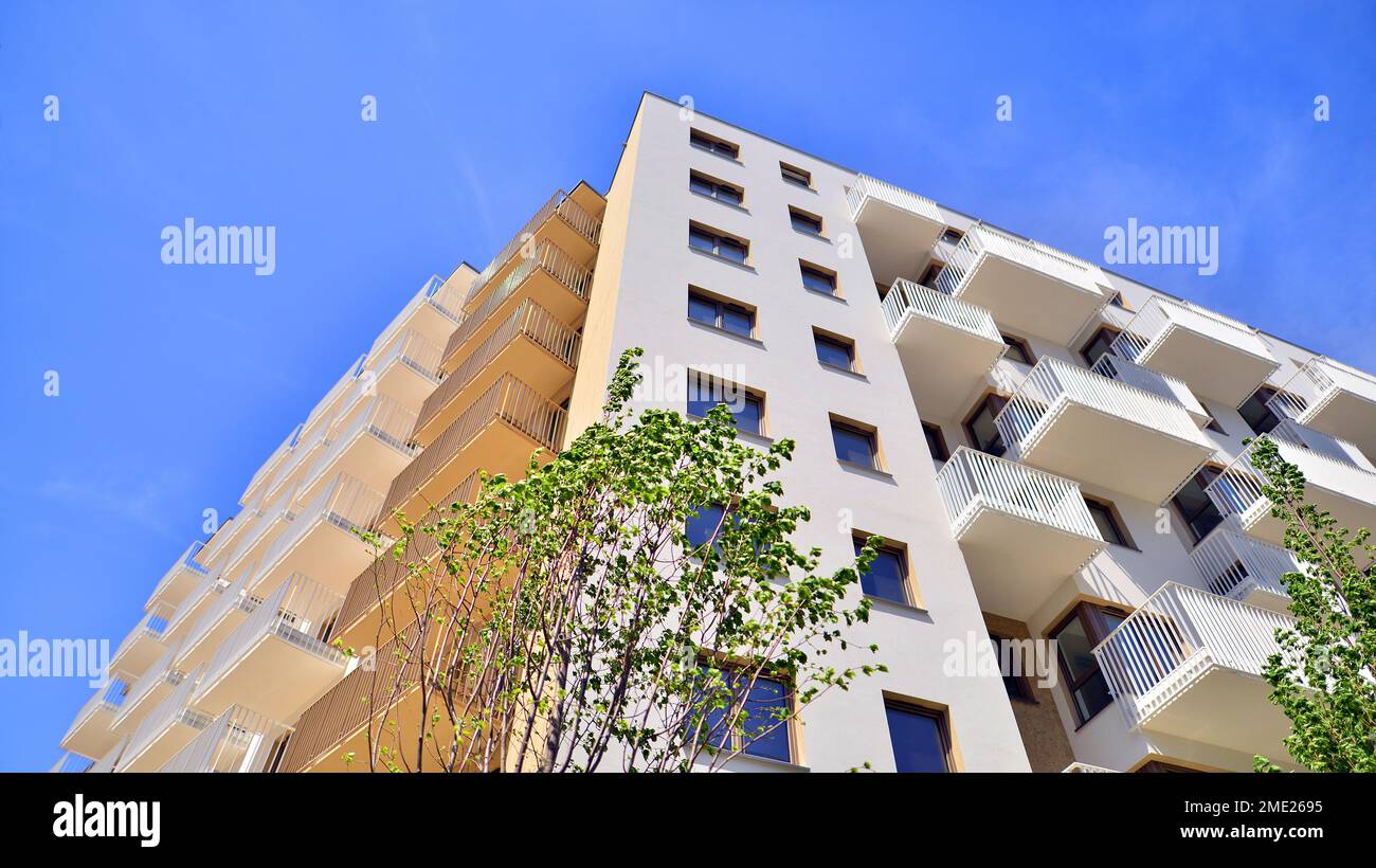Eco architecture. Green tree and apartment building. The harmony of ...