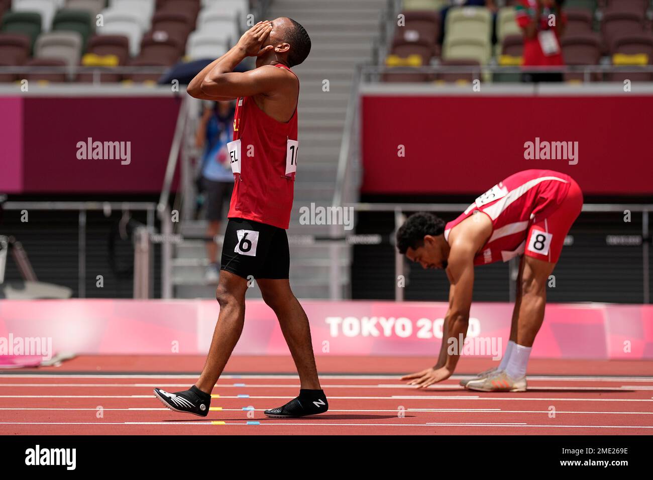 Aveni Miguel, of Angola, reacts as he is disqualified after a false ...