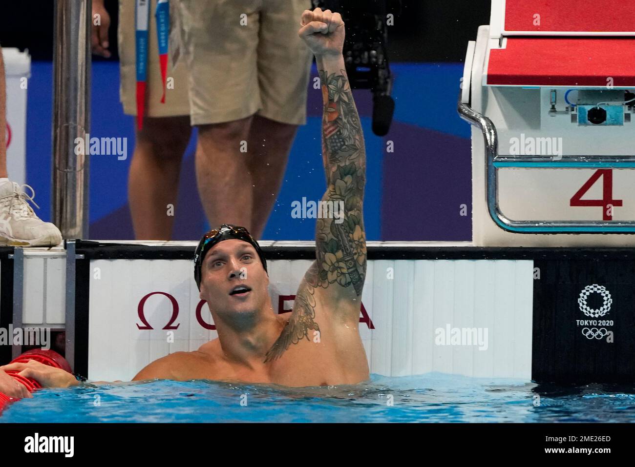 Caeleb Dressel, of United States, celebrates after winning the gold ...