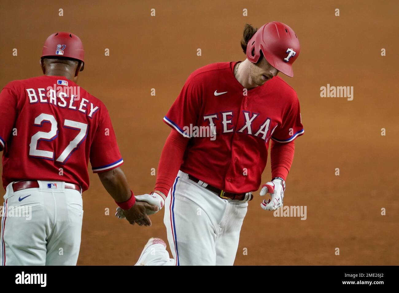 Texas Rangers third base coach Tony Beasley (27) congratulates Jonah ...