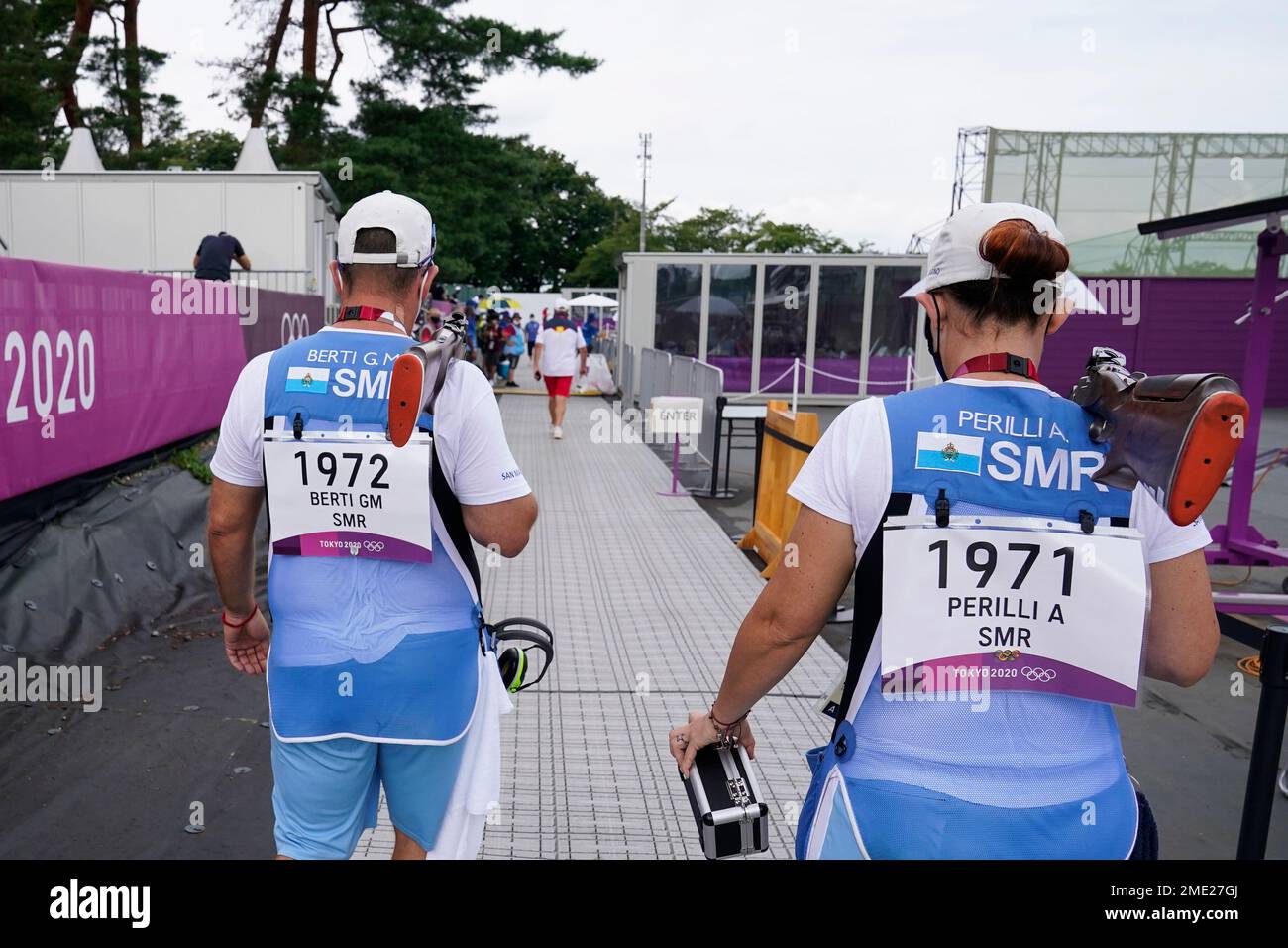 Gian Marco Berti, and Alessandra Perilli, both of San Marino, walk to ...