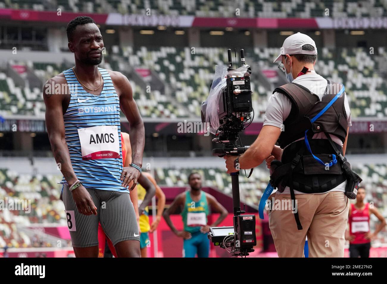 Nijel Amos, of Botswana, reacts after winning a heat wins a heat in the ...