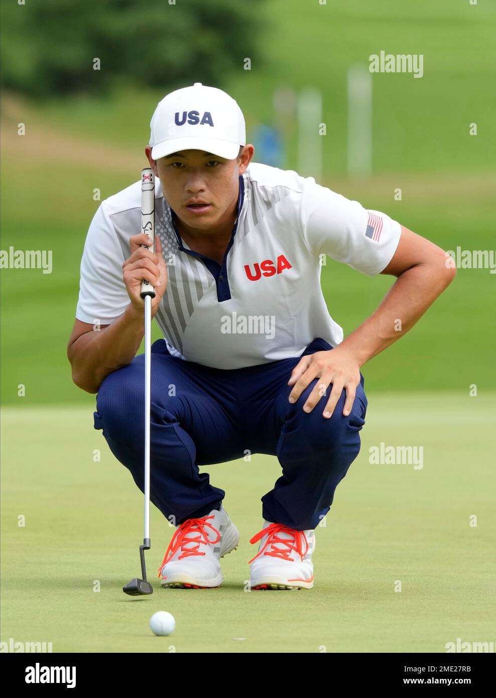 Collin Morikawa of United States studies his putt on the first green ...