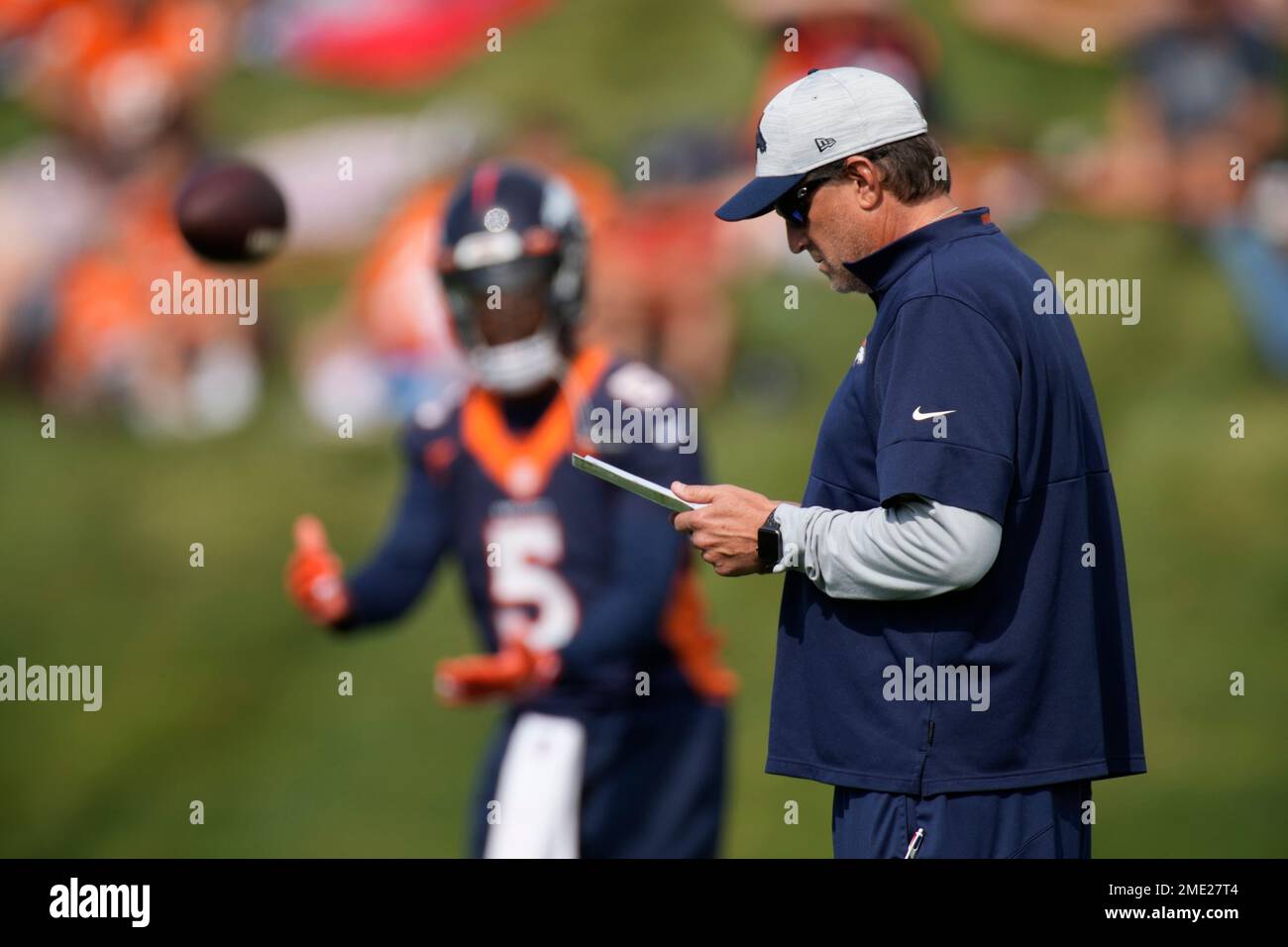 Denver Broncos quarterbacks coach Mike Shula () takes part in drills at ...