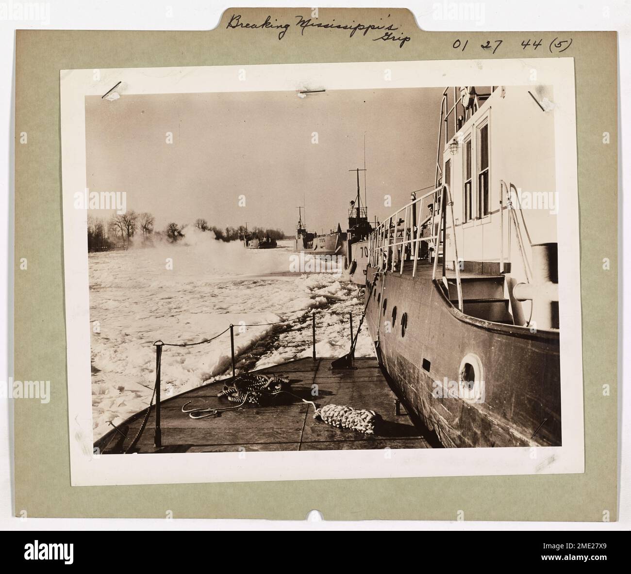 A plow attached to a Coast Guard craft is used to smash through thick ...