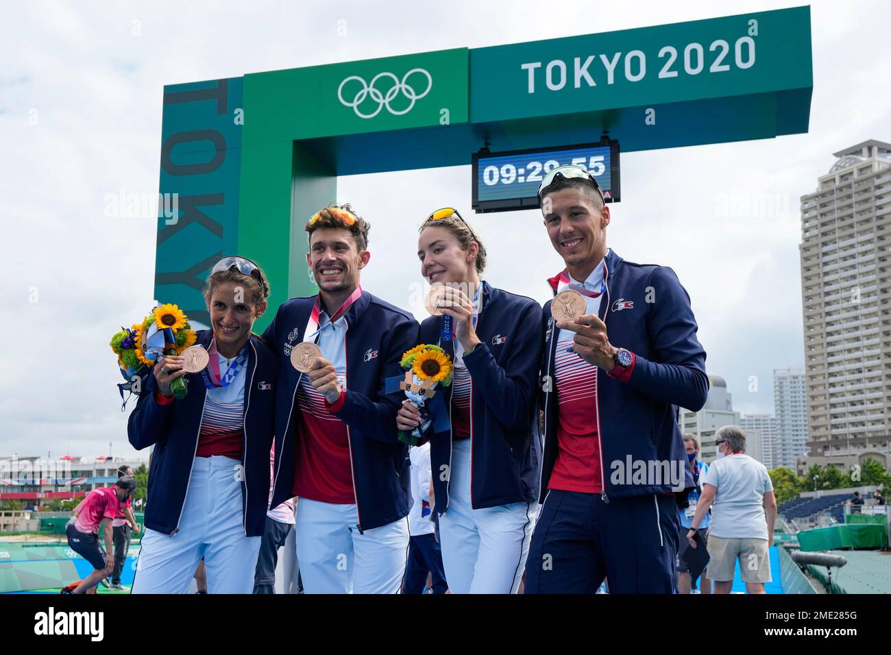 The team from France pose with their Bronze medal in the mixed relay ...