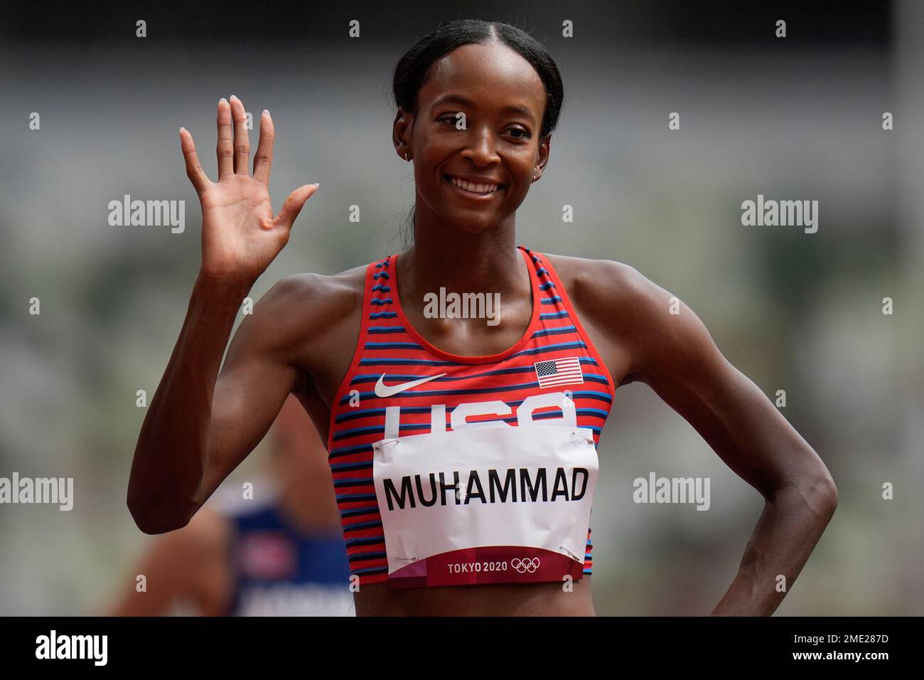 Dalilah Muhammad, of United States, reacts after winning a heat in the ...