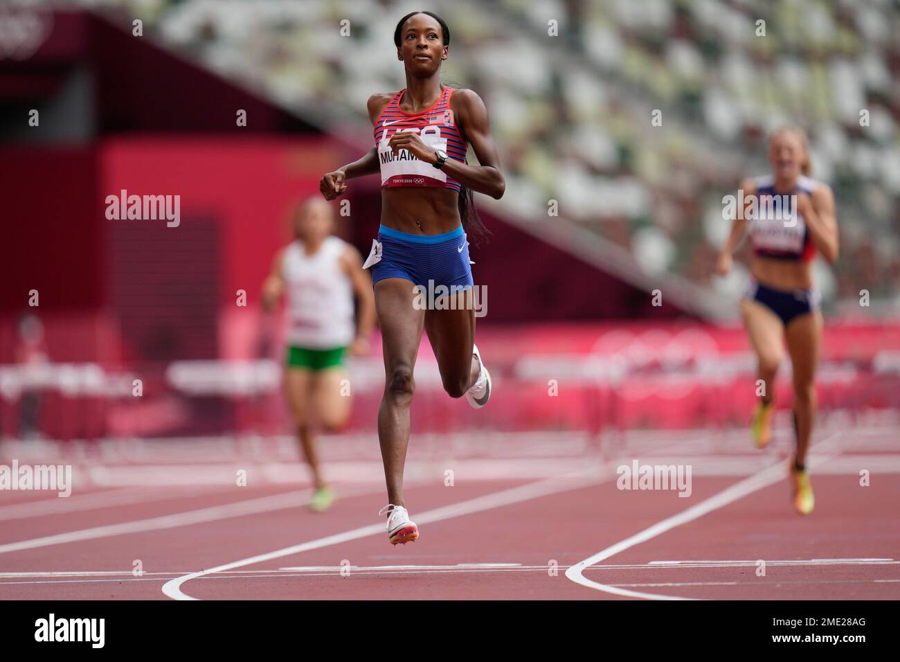 Dalilah Muhammad, of United States, wins a heat in the women's 400 ...