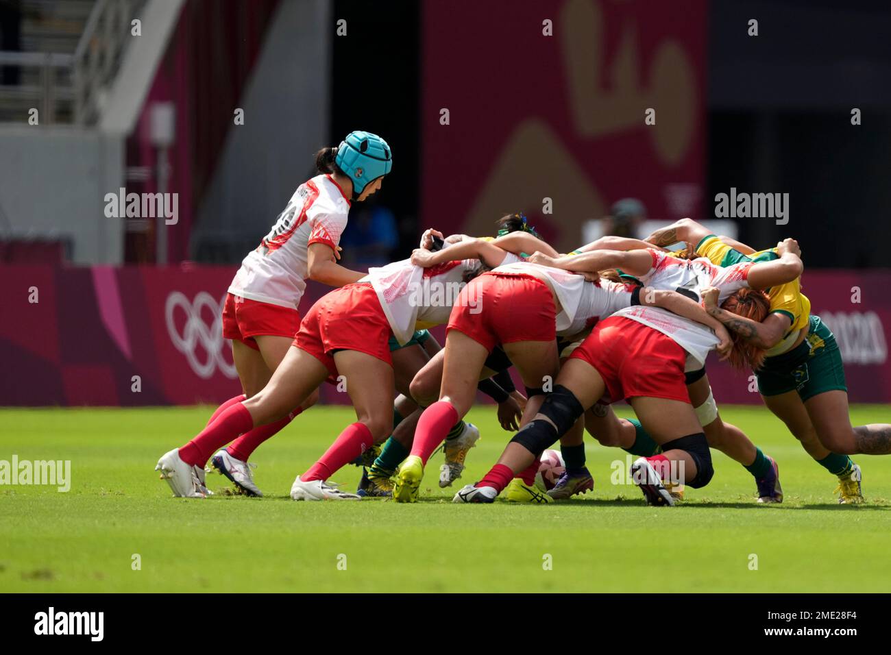 Japan and Brazil players vie for the ball in a scrum, in their women's ...