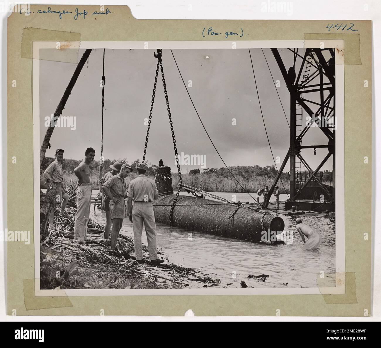 A two-man Japanese submarine is salvaged from the waters near ...