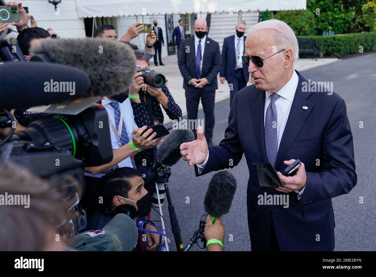 President Joe Biden speaks to reporters before boarding Marine One on ...