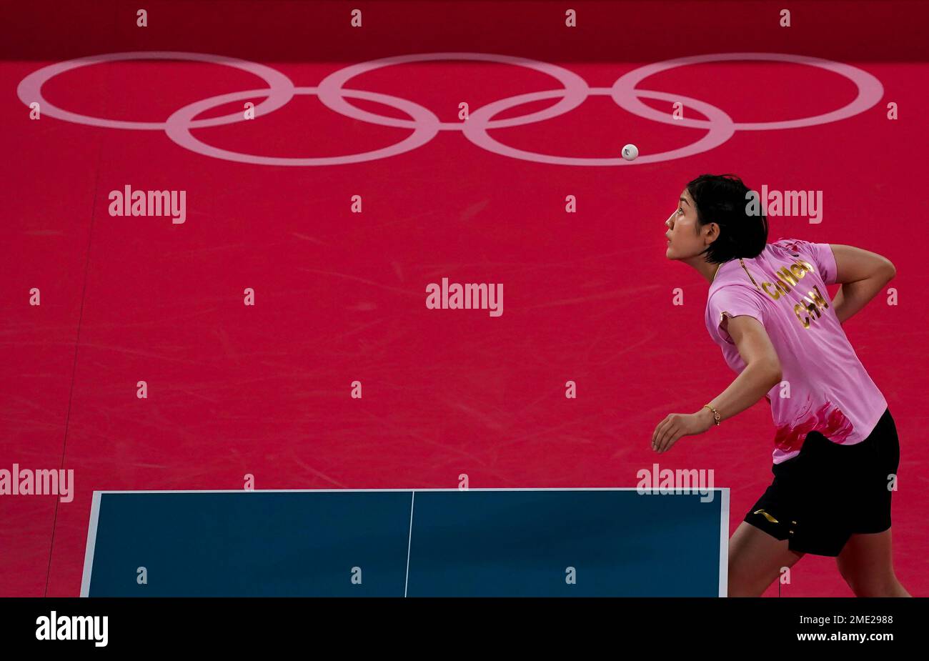 China's Chen Meng eyes the ball on a serve as she competes against Doo ...