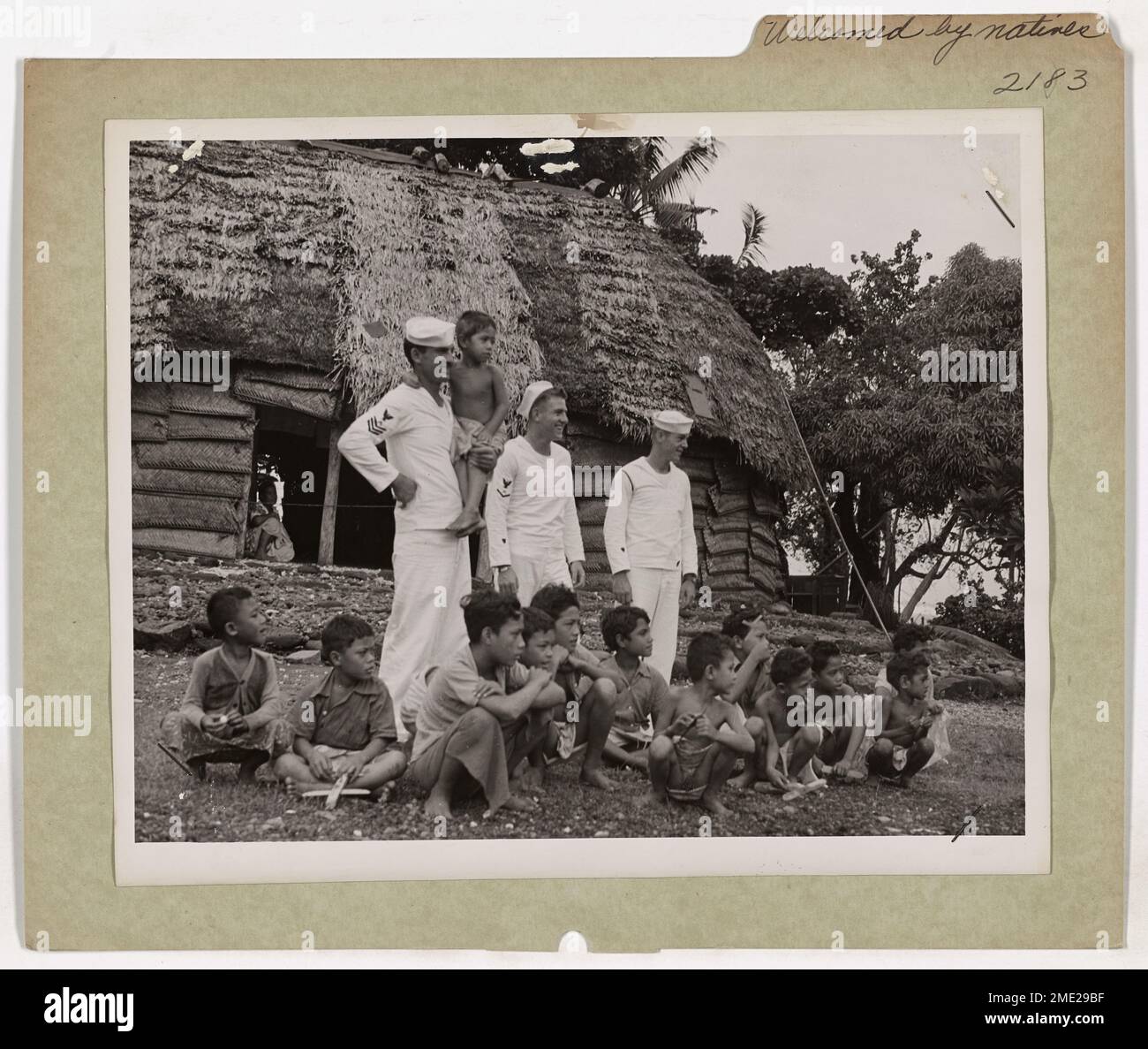 Three Coast Guardsmen, on shore leave in the South Pacific, are ...
