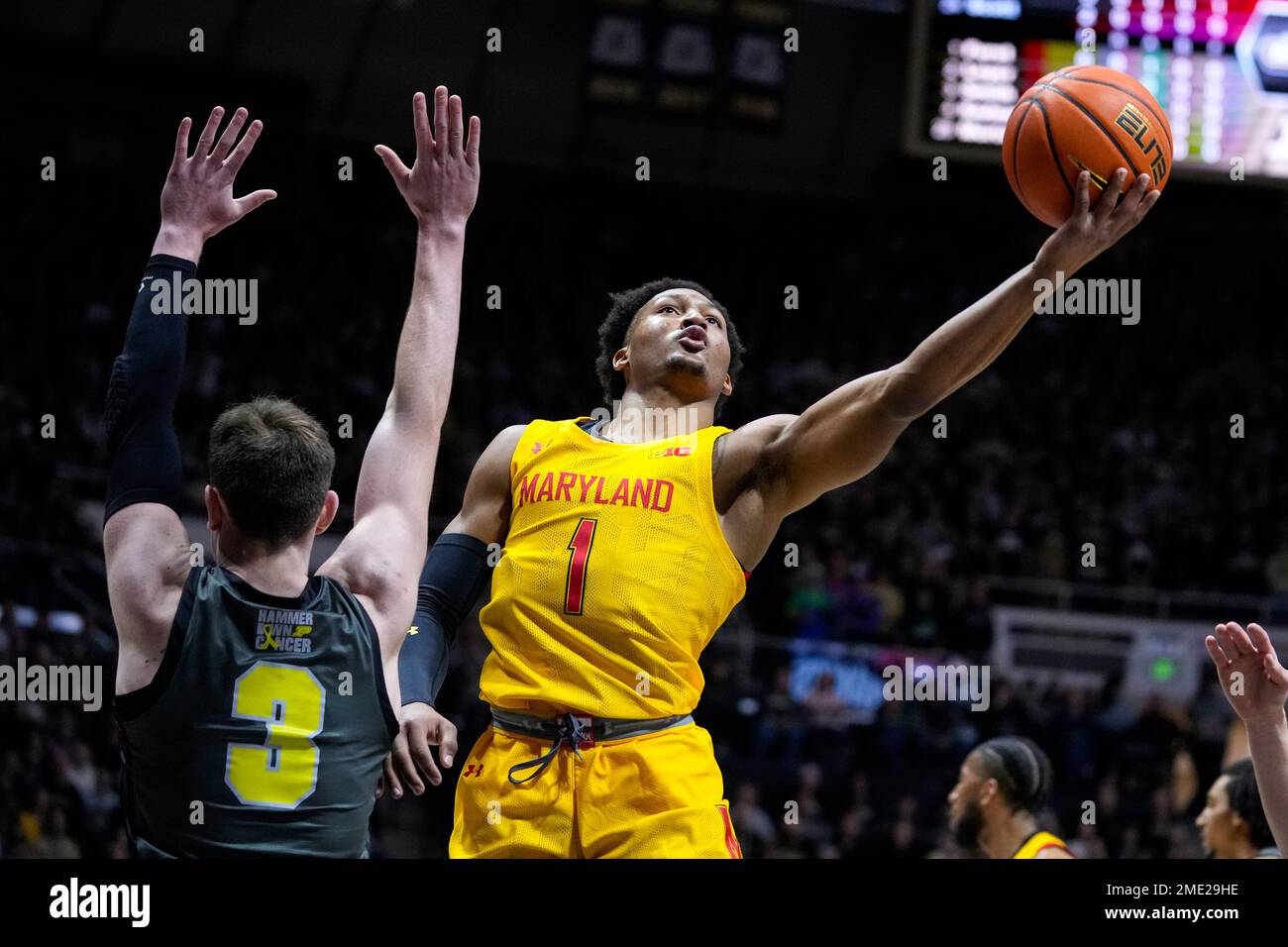 Maryland guard Jahmir Young (1) shoots around Purdue guard Braden Smith ...
