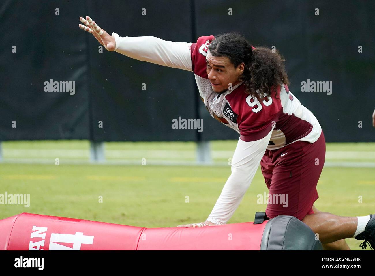 Arizona Cardinals defensive tackle Leki Fotu knocks down a tackling ...