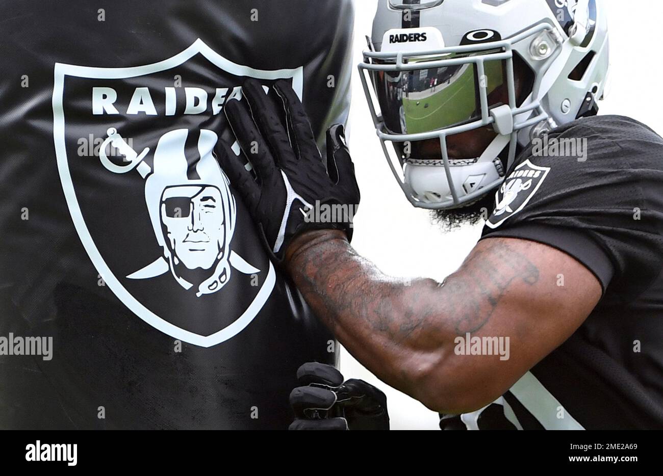 Las Vegas Raiders defensive end Yannick Ngakoue runs a drill during an NFL football practice ...