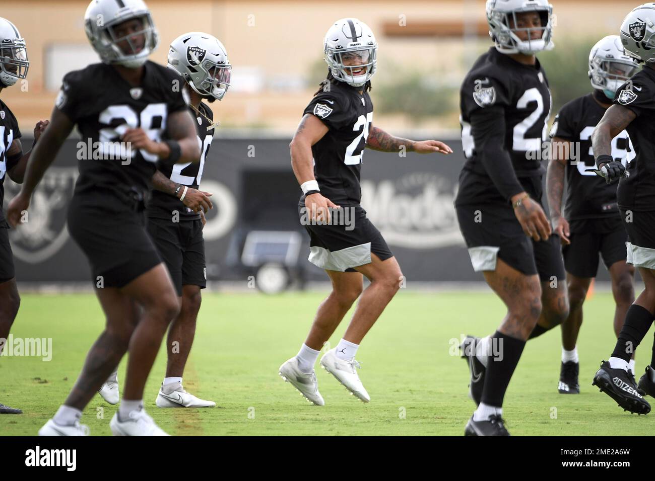 Las Vegas Raiders safety Tre'von Moehrig, center, warms up during an ...