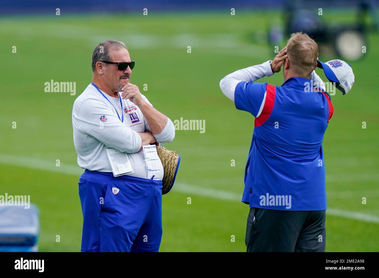 New York Giants general manager Dave Gettleman at left speaks to a ...