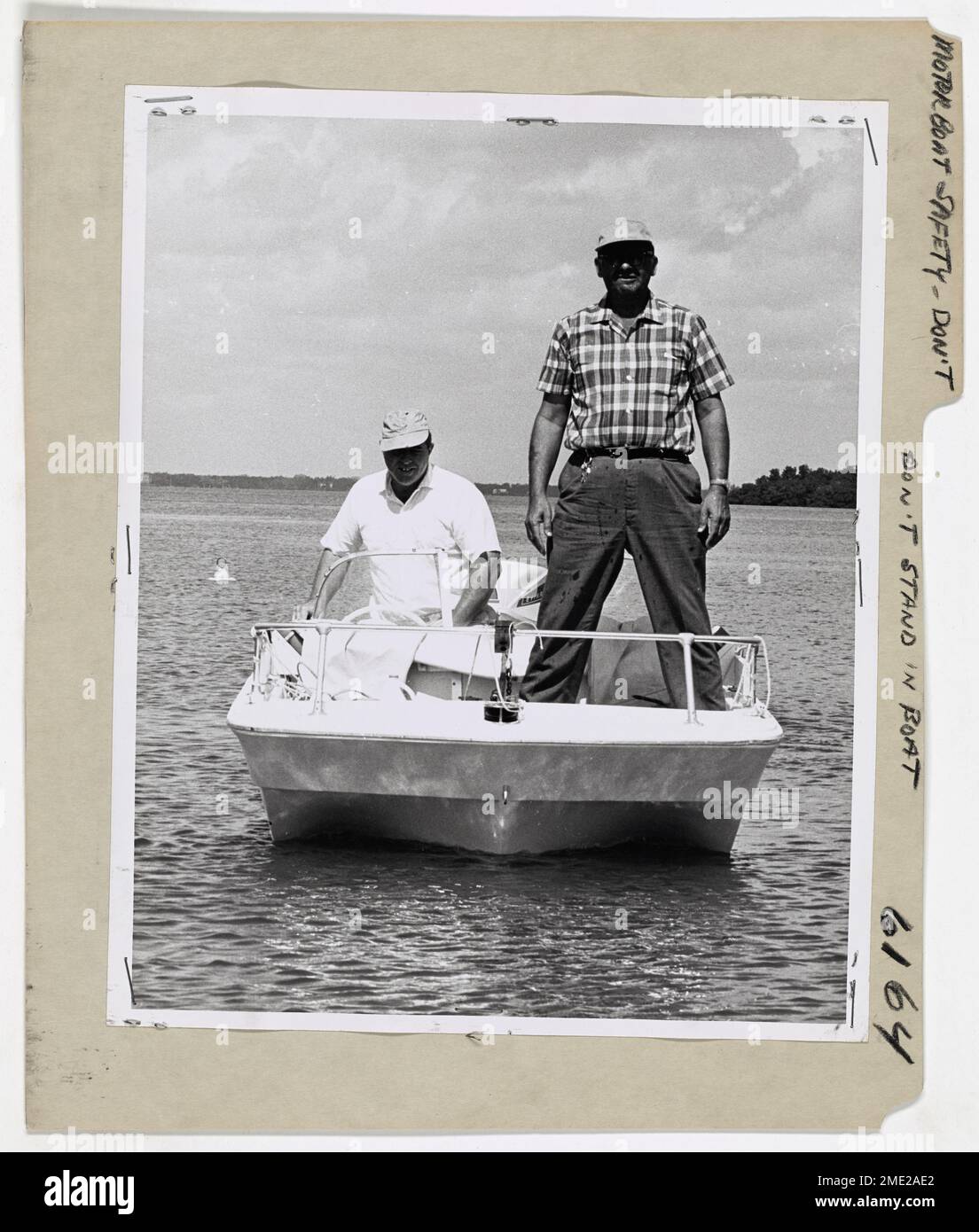 A boatman in an outboard motorboat demonstrates the risks of standing ...