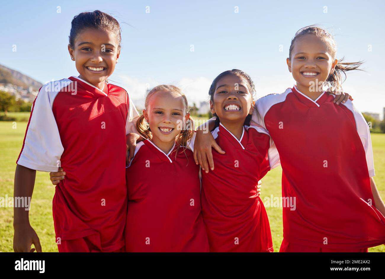 Girl, soccer group portrait and field with smile, team building ...