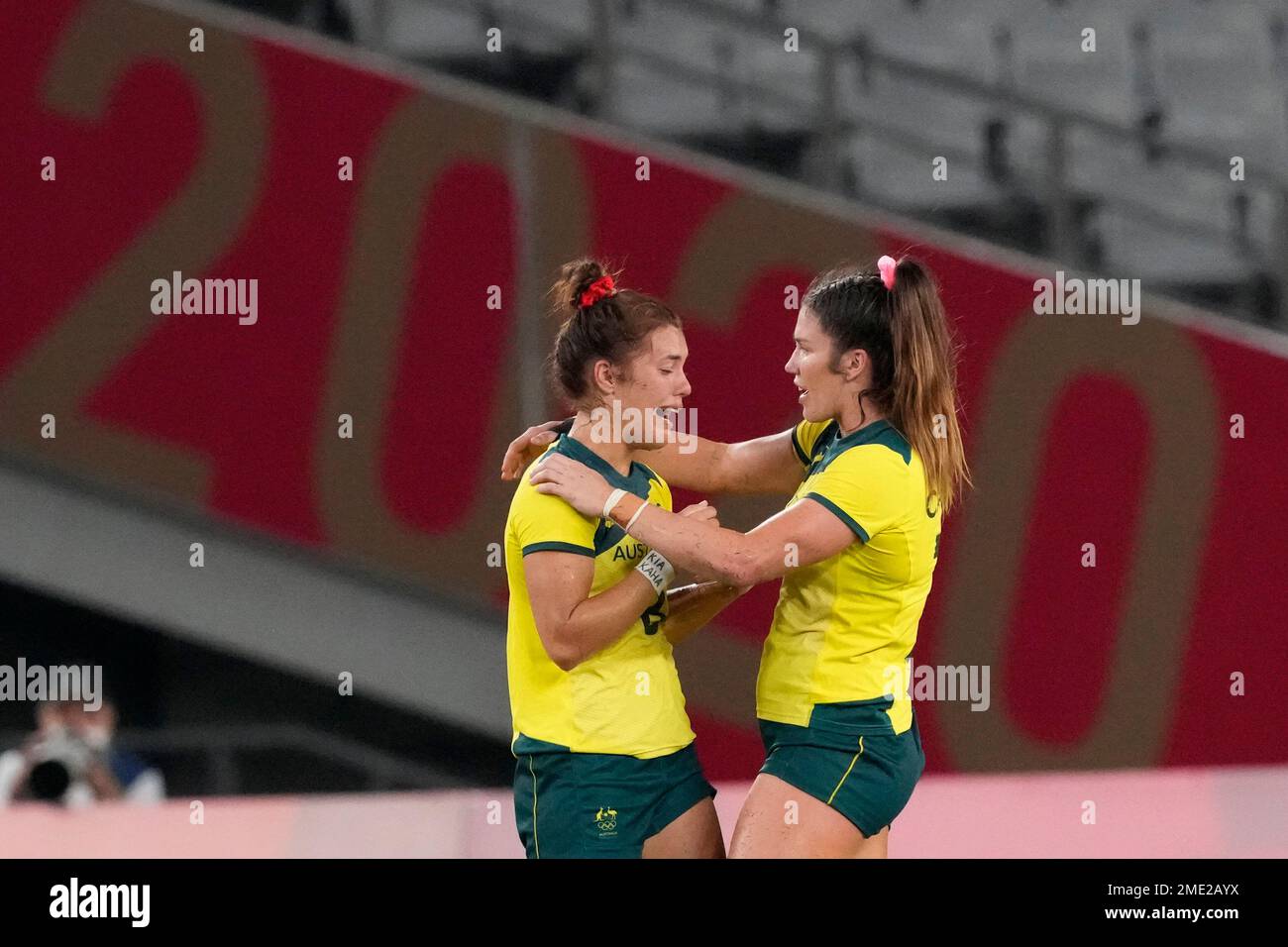 Australia's Madison Ashby, left, is comforted by teammate Charlotte ...