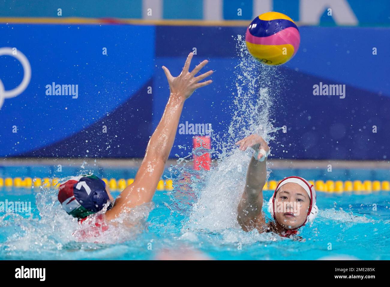 Japan's Kyoko Kudo, right, passes the ball away from Hungary's Anna ...