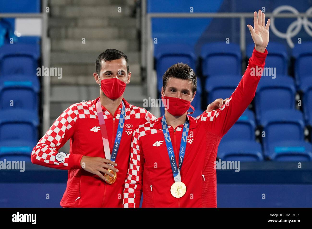 Mate Pavic, left, and Nikola Mektic, of Croatia, pose with their gold ...