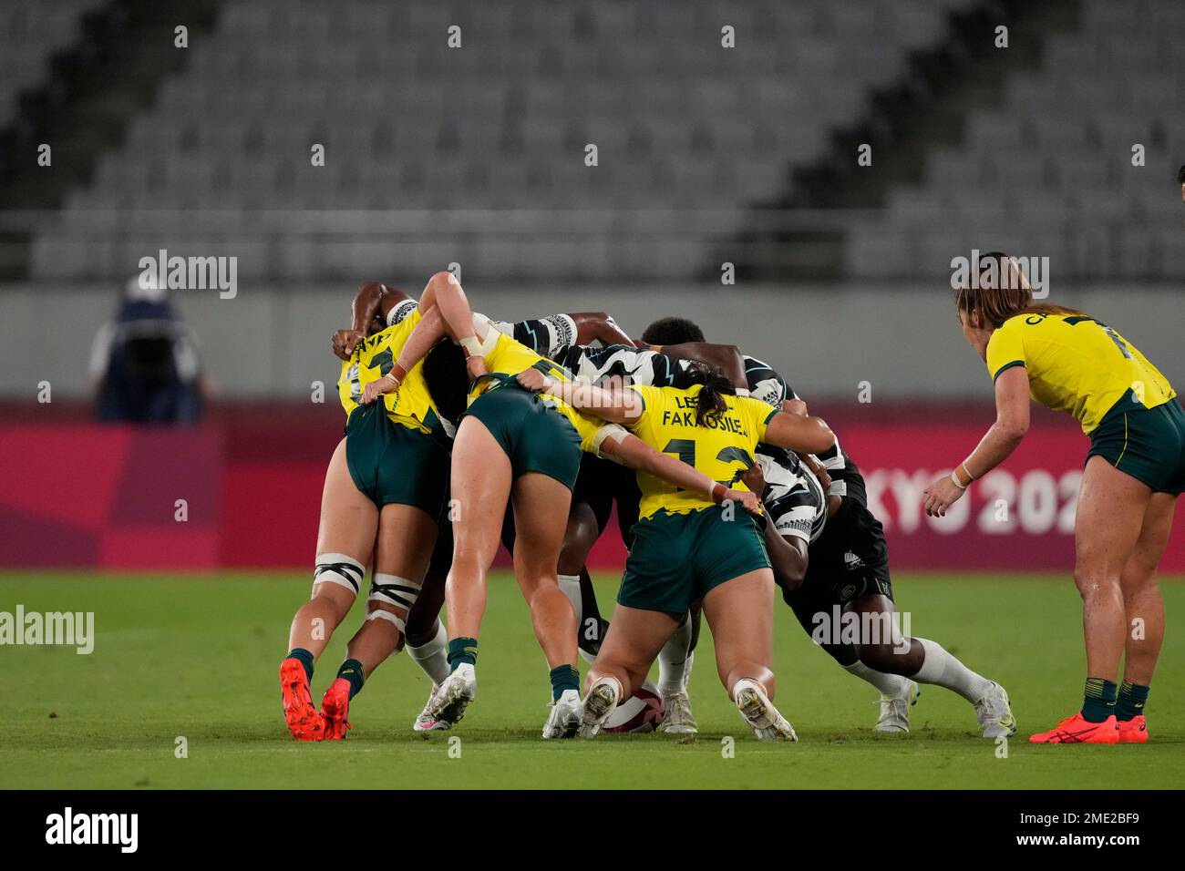 Australia and Fiji players wrangle in a scrum, during their women's ...