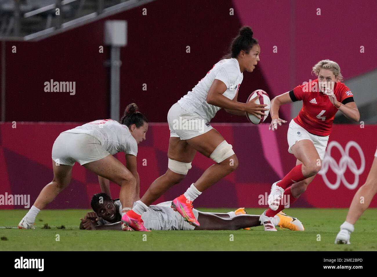 Ariana Ramsey of the United States runs with the ball, pursued by ...