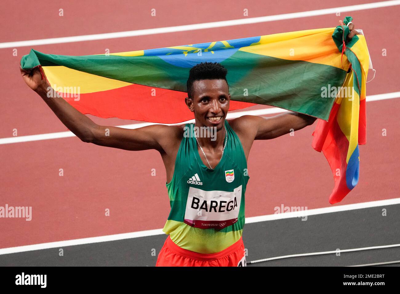 Selemon Barega, of Ethiopia, celebrates after winning the men's 10,000 ...