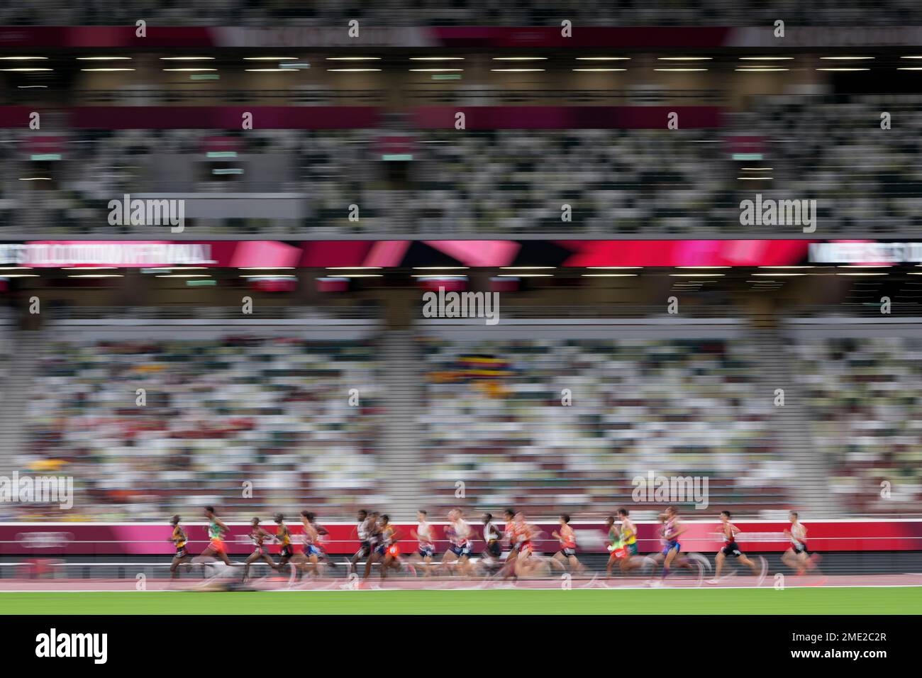 Competitors run in the men's 10,000-meters final at the 2020 Summer ...